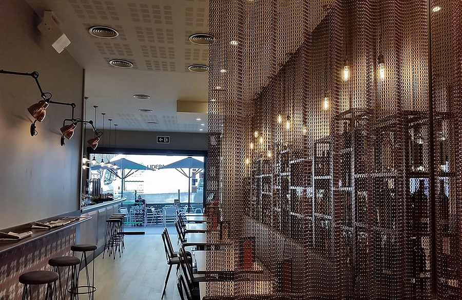 Revolutionizing Spaces with Kriskadecor's Undulating Metal Fabric ...